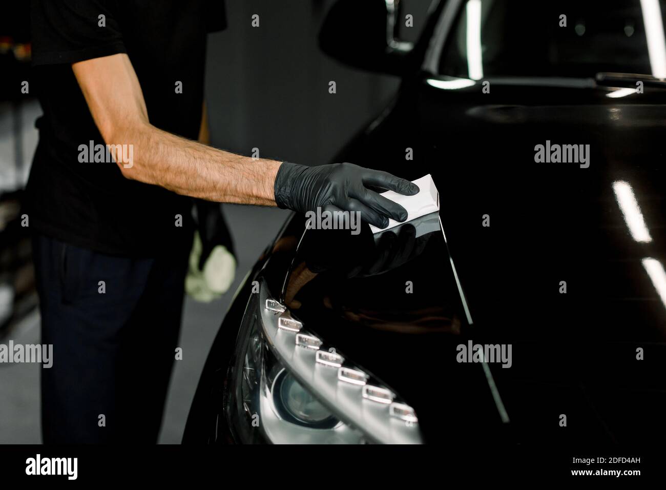 Protection the car body from scratches, chips and damage. Cropped close ...