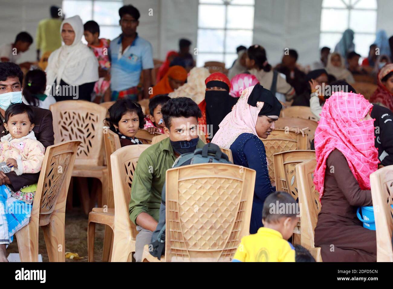 Rohingya refugees wait to board a Bangladesh Navy ship to be ...