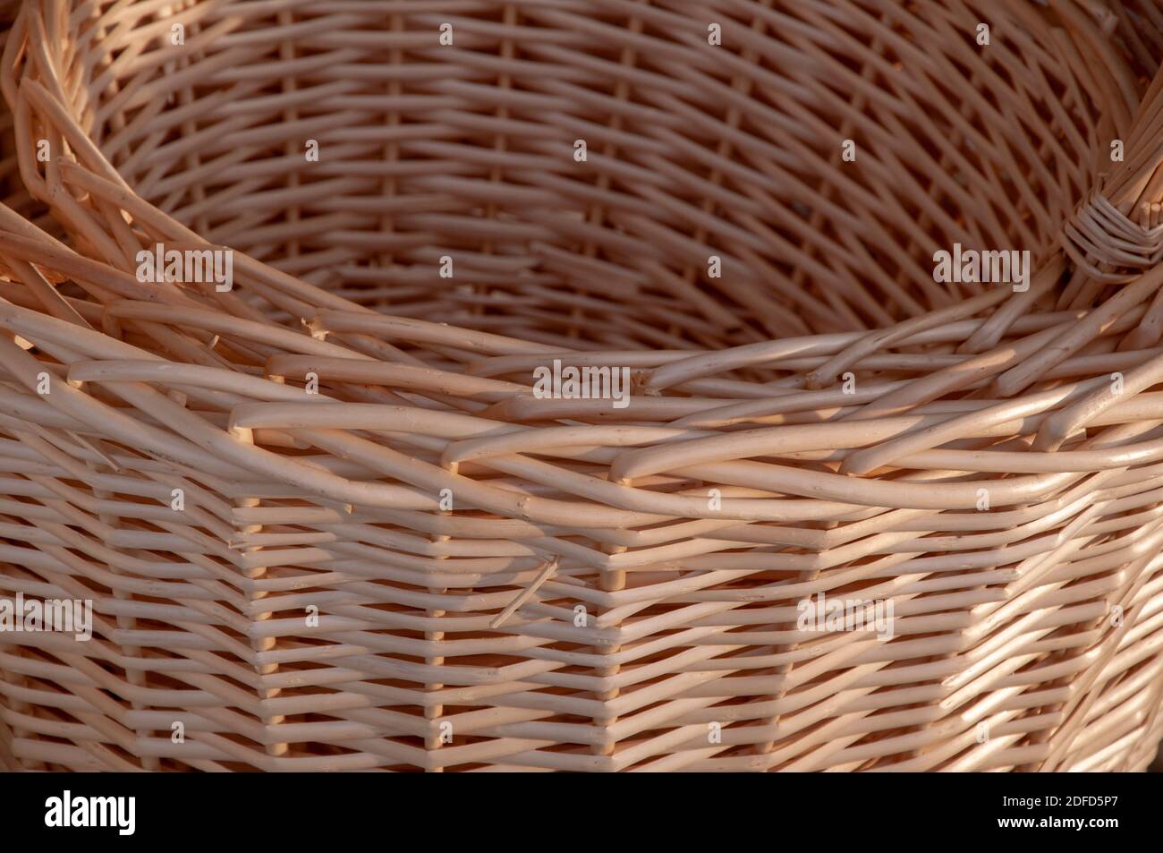 Wooden wickerwork with yellow straws Stock Photo - Alamy