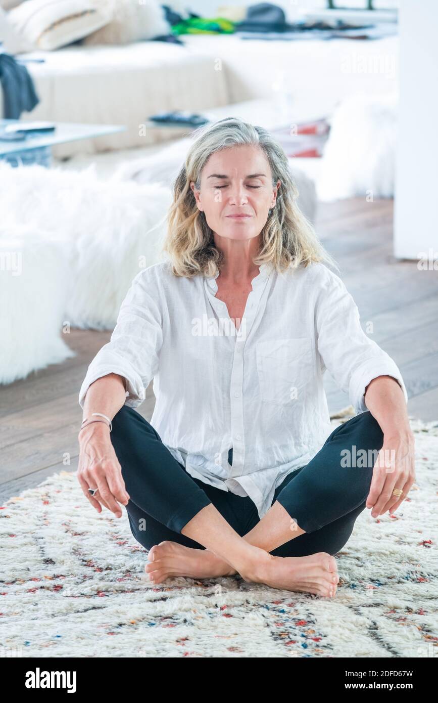 Woman practicing relaxation exercises Stock Photo - Alamy