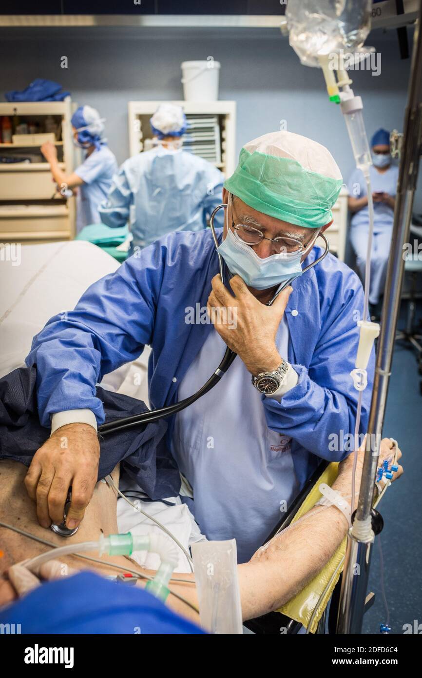 Anesthesiologist and in the operating room at the end of an operation ...