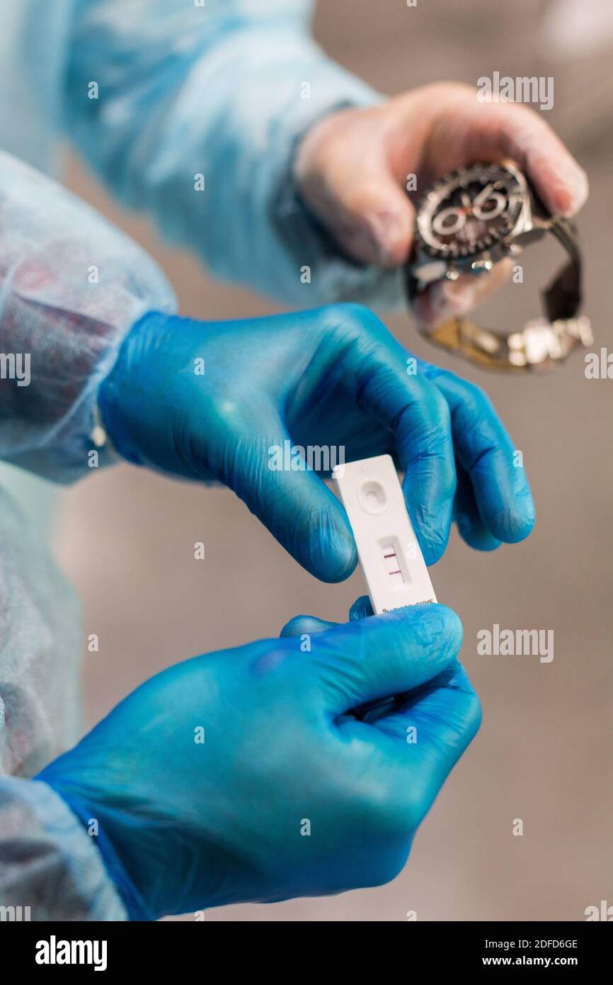 Pharmacist carries out an antigenic test for the detection of antigens ...