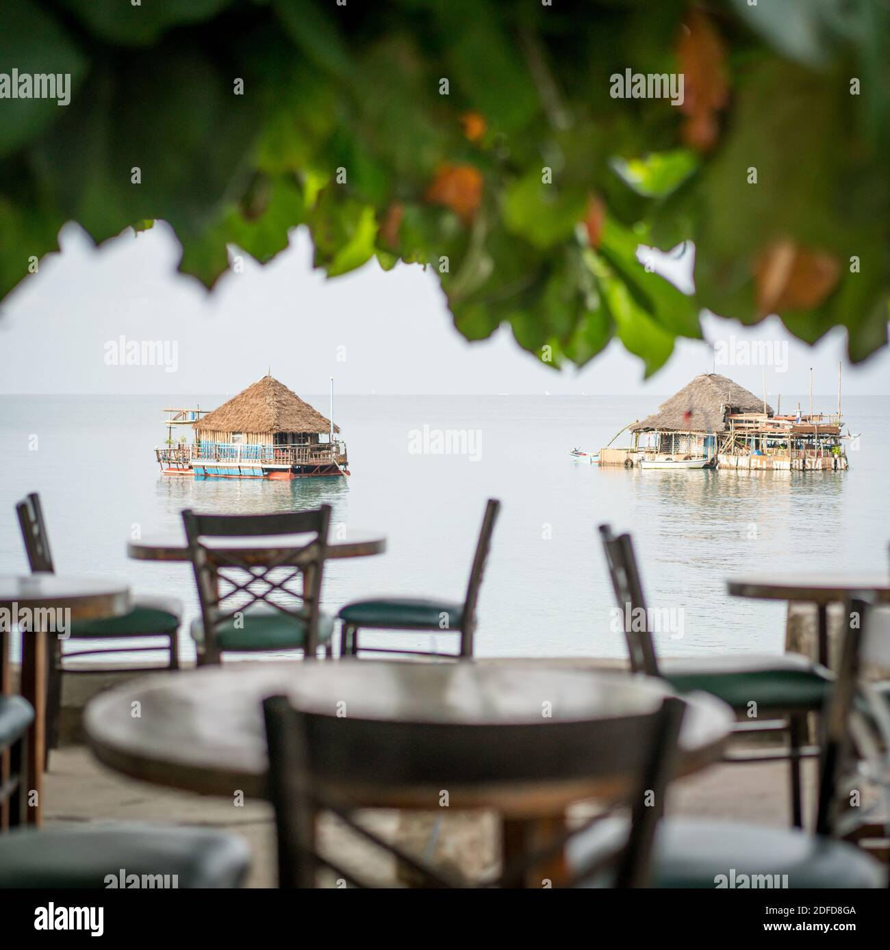 Tropical restaurant on beach Stock Photo - Alamy