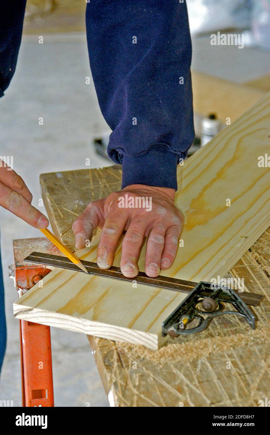 Carpenter using hand square tool to make an accurate measurement Stock ...