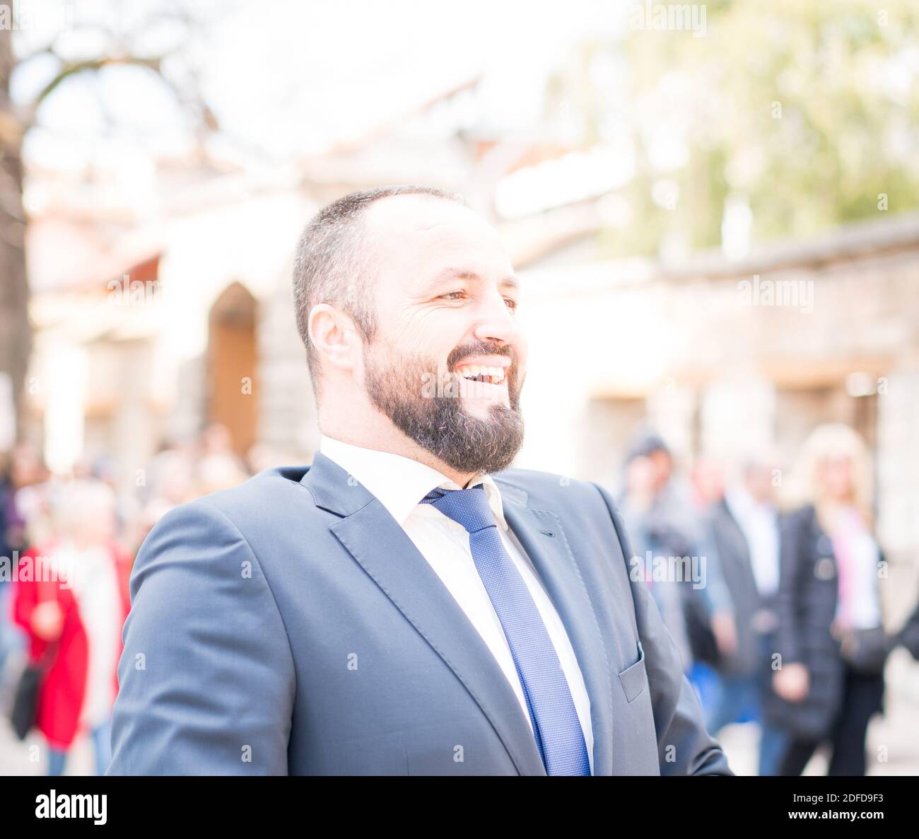 Man laughing on street Stock Photo - Alamy