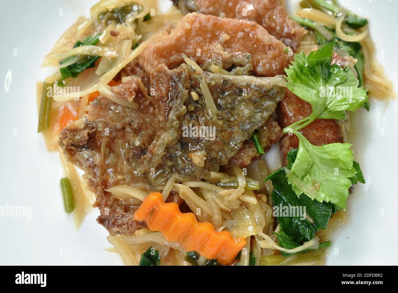 deep fried chop fish with slice ginger and celery on plate Stock Photo ...
