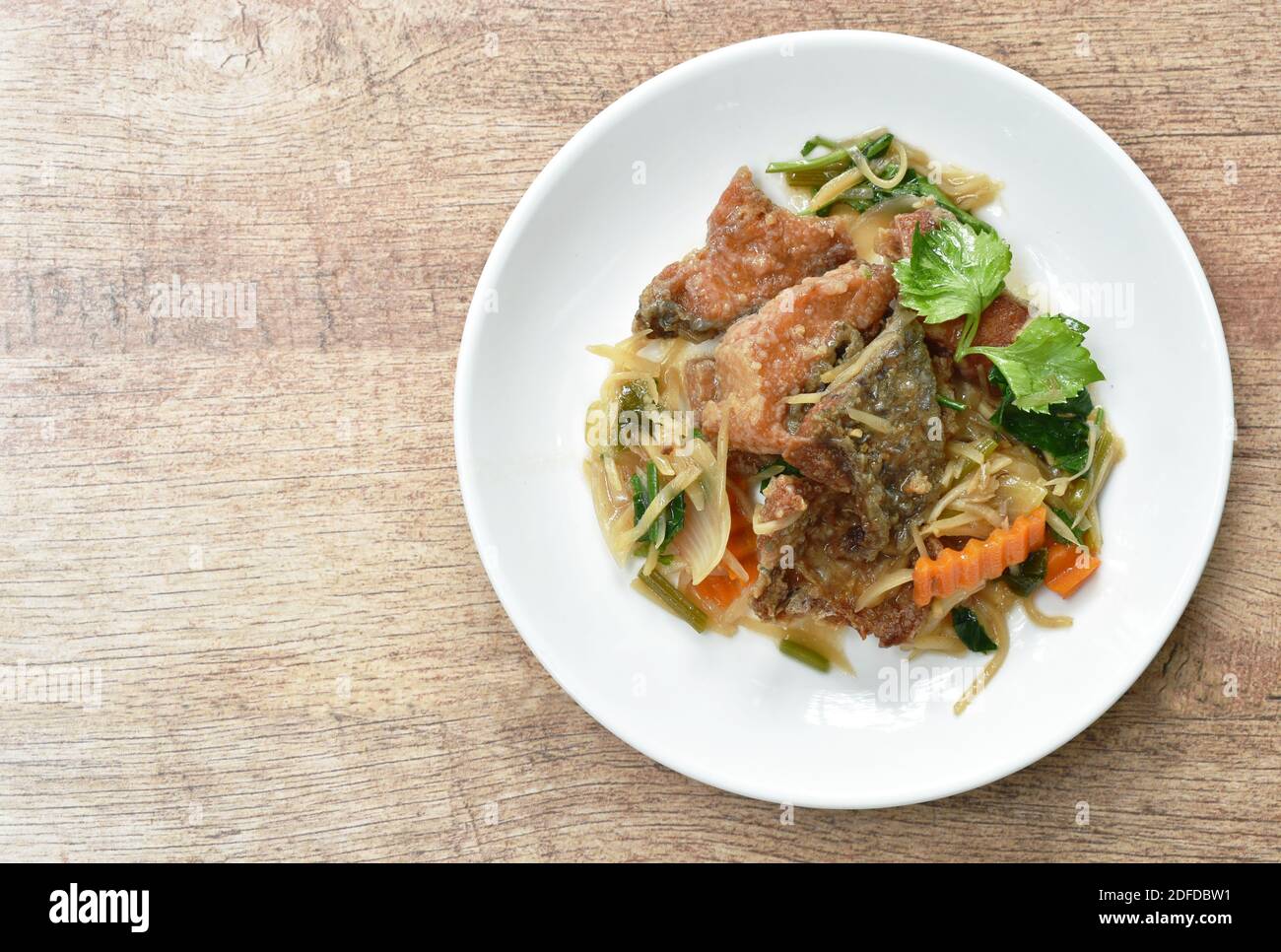 deep fried chop fish with slice ginger and celery on plate Stock Photo ...