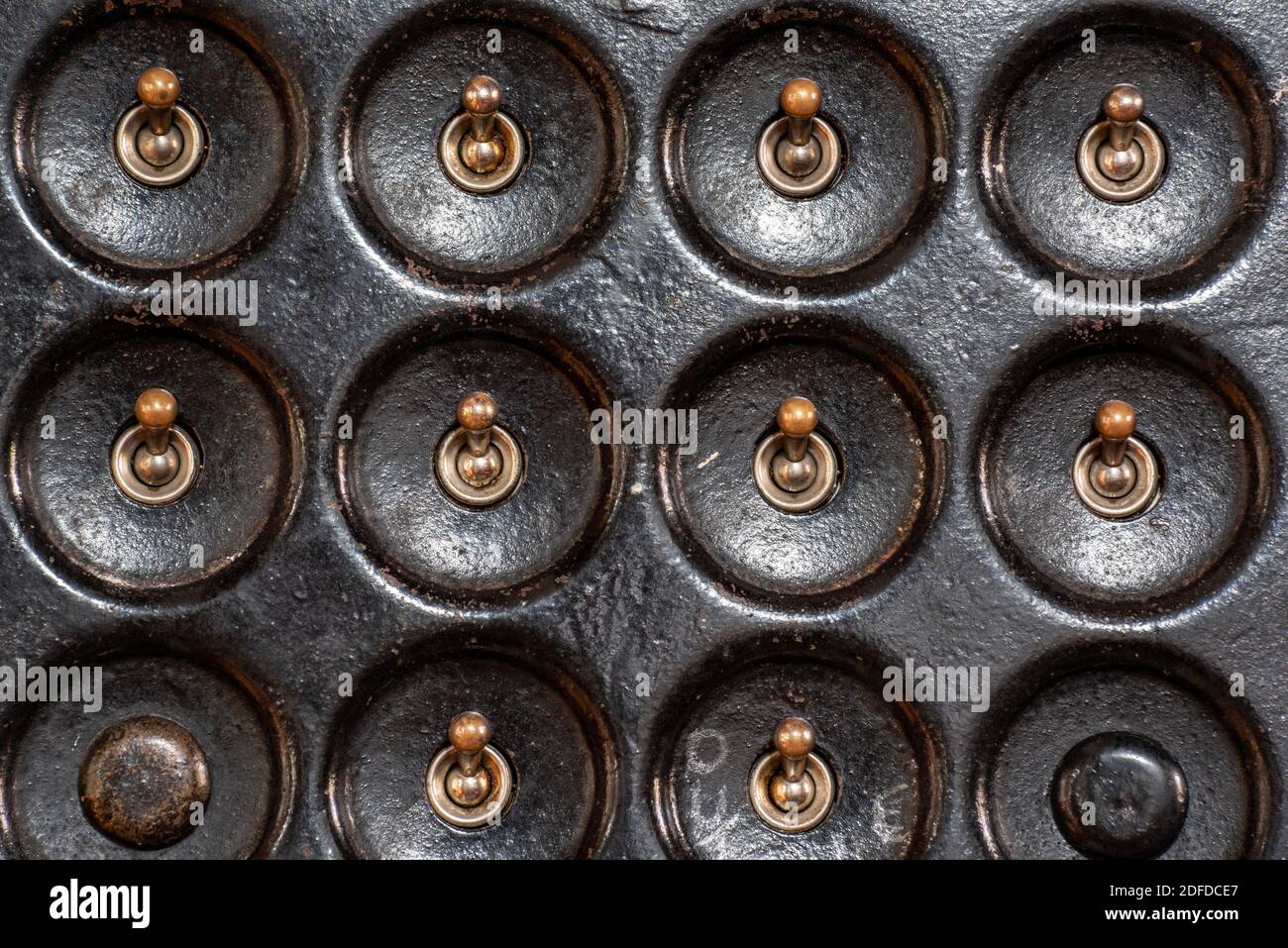 Panel of old light switches Stock Photo - Alamy
