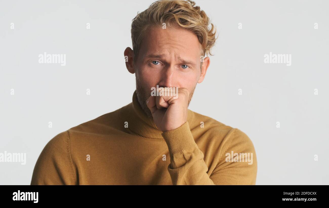 Young bearded man coughing on camera over white background. Choke ...