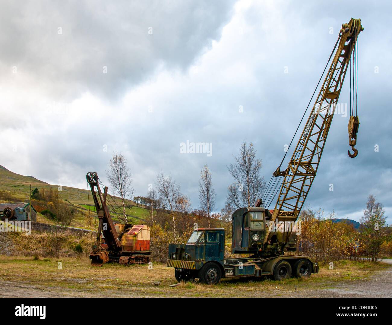 Old abandoned crane and excavator Stock Photo - Alamy