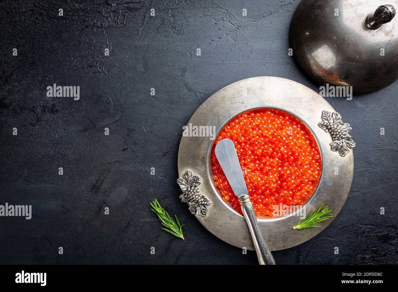 Delicious red caviar in vintage plate, top view, dark background Stock ...