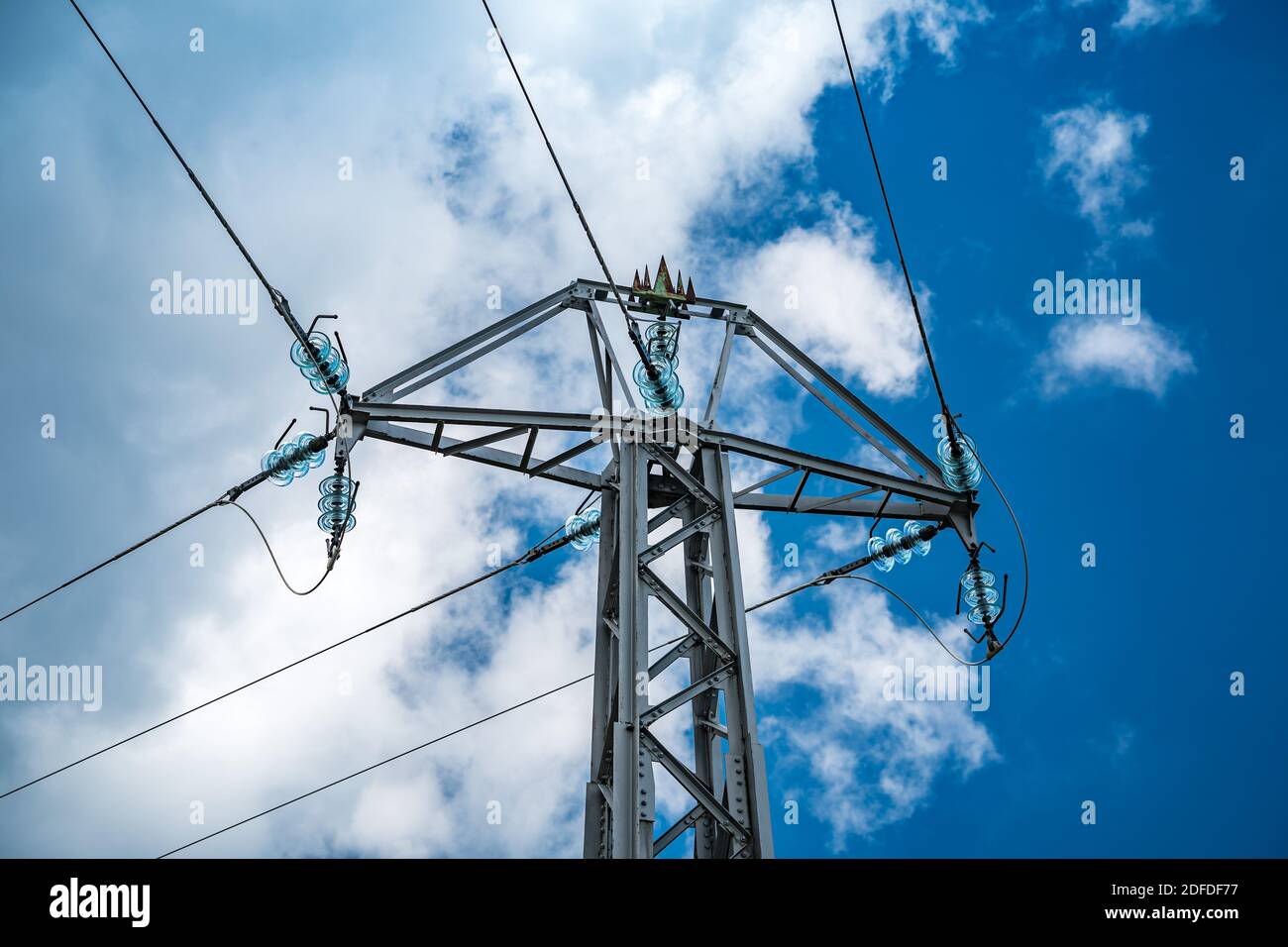 High-voltage insulated wires on glass insulators of power transmission ...