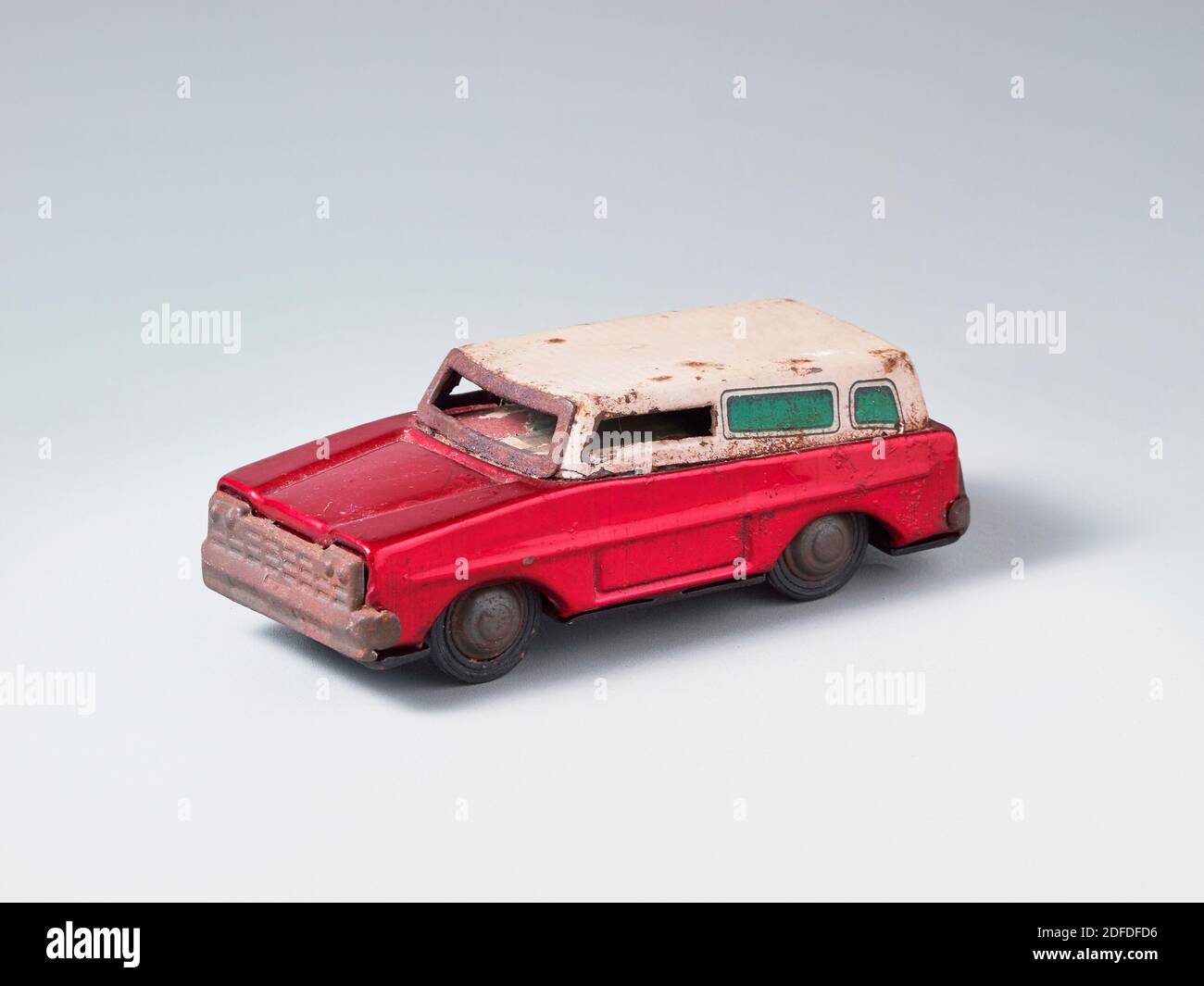A rustic red and white tin toys van in the grey rustic tin toys van at ...