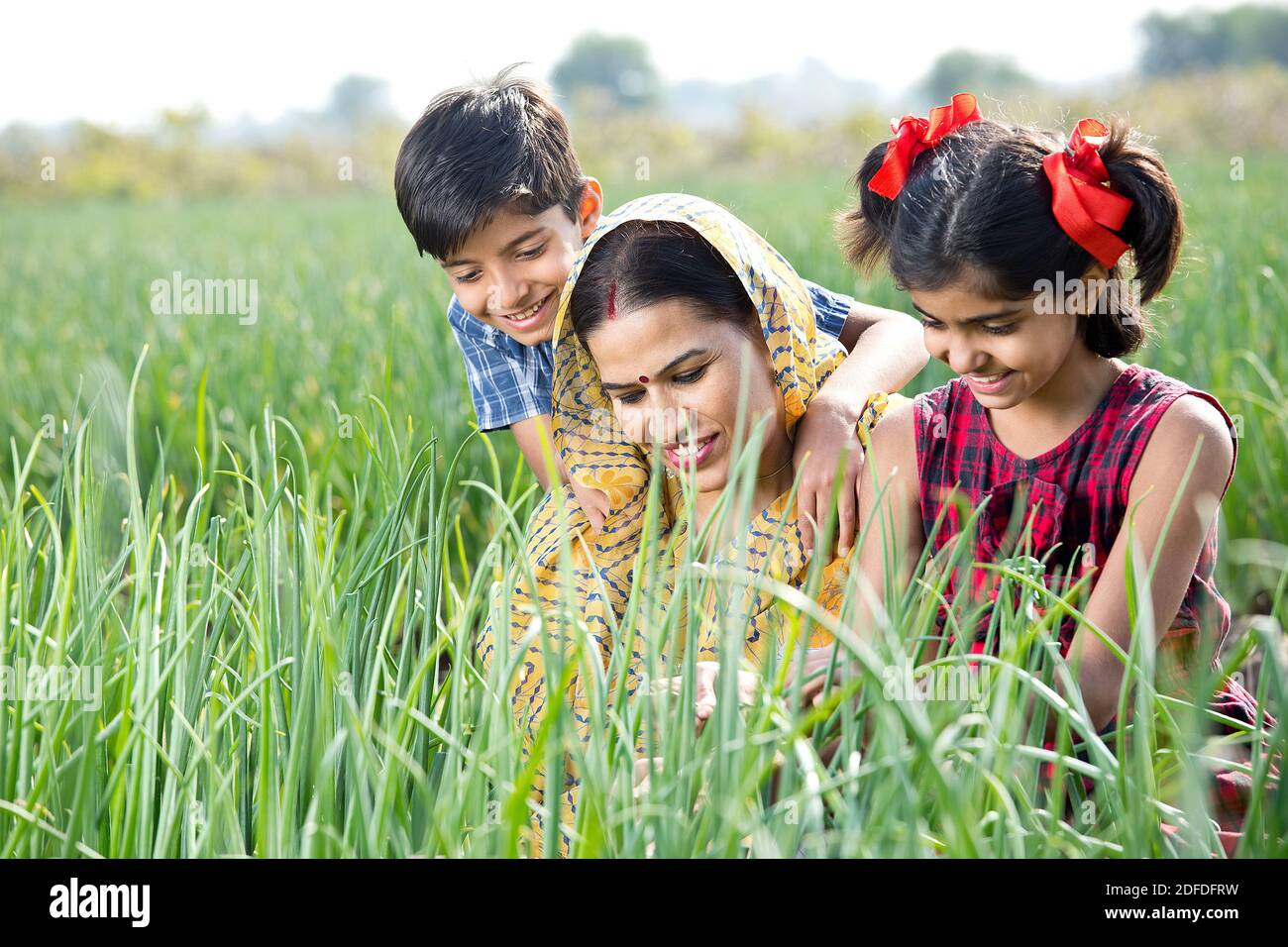 Rural mother with children in agricultural field Stock Photo - Alamy