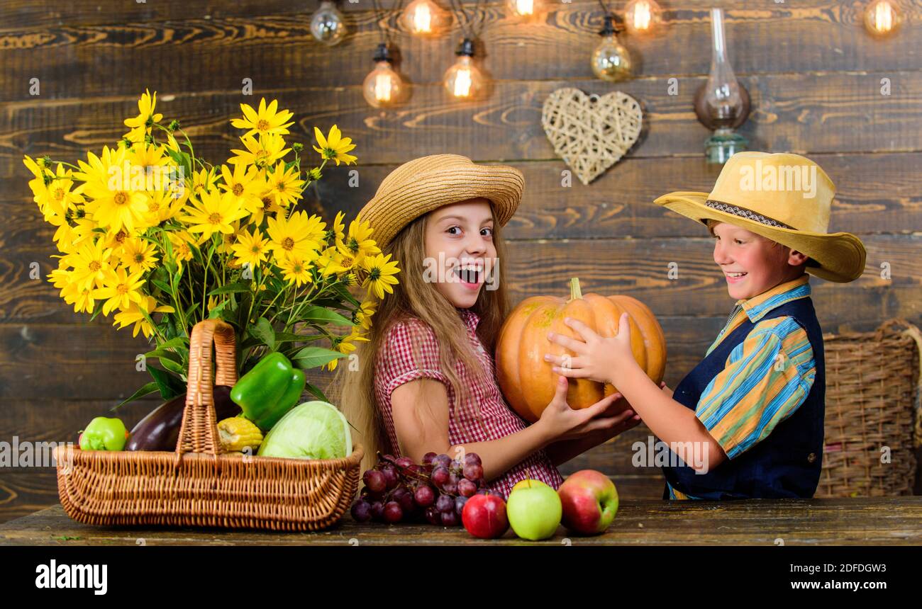 Siblings having fun. Family farm. Farm market. Children presenting farm ...