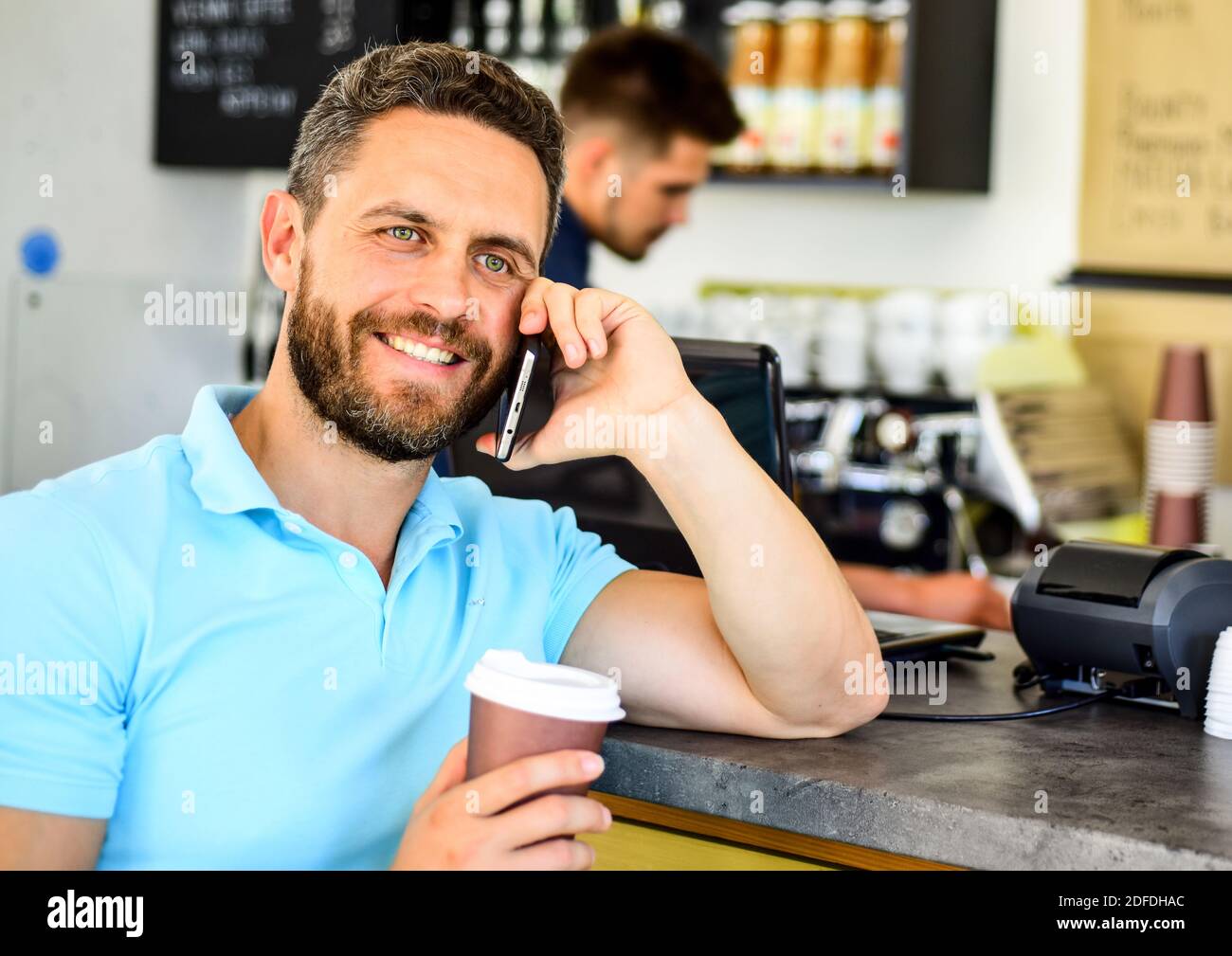 Drink coffee while waiting. Waiting for you. Man smartphone order ...