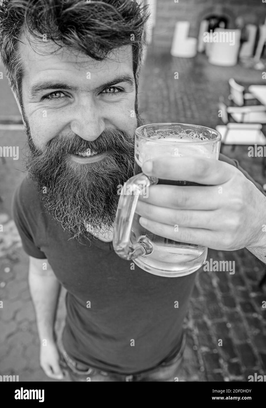 Guy having rest with cold draught beer. Hipster on smiling face ...