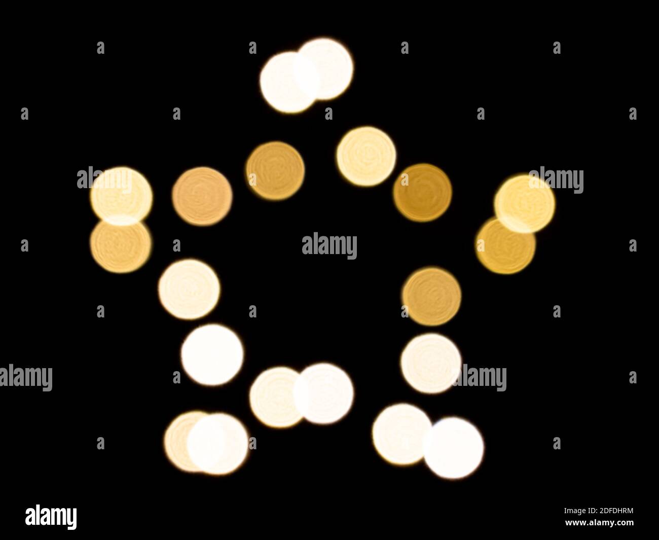 Defocused picture of star shaped light on the black background Stock ...