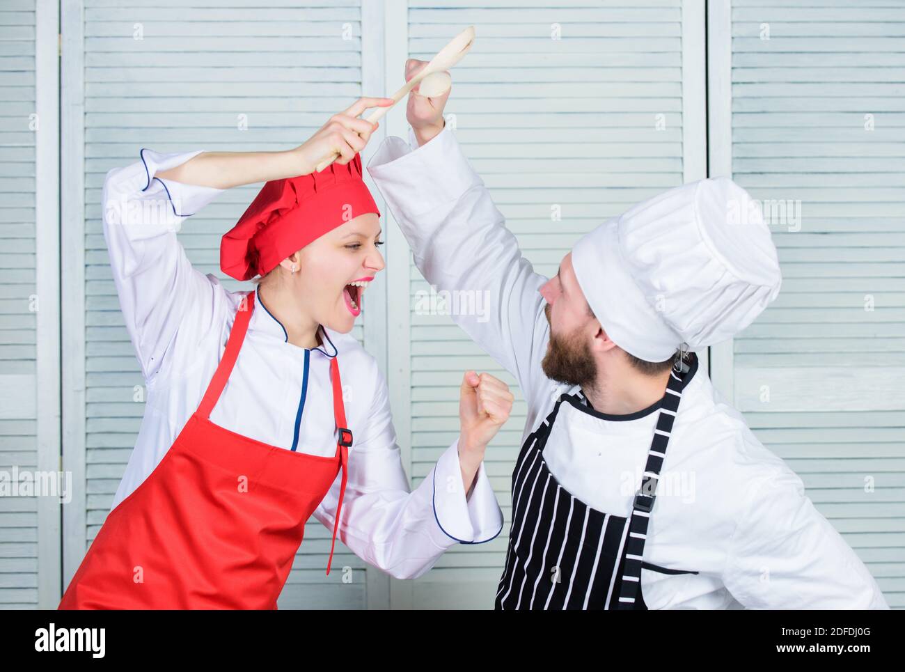 Ultimate cooking challenge. Culinary battle of two chefs. Couple ...