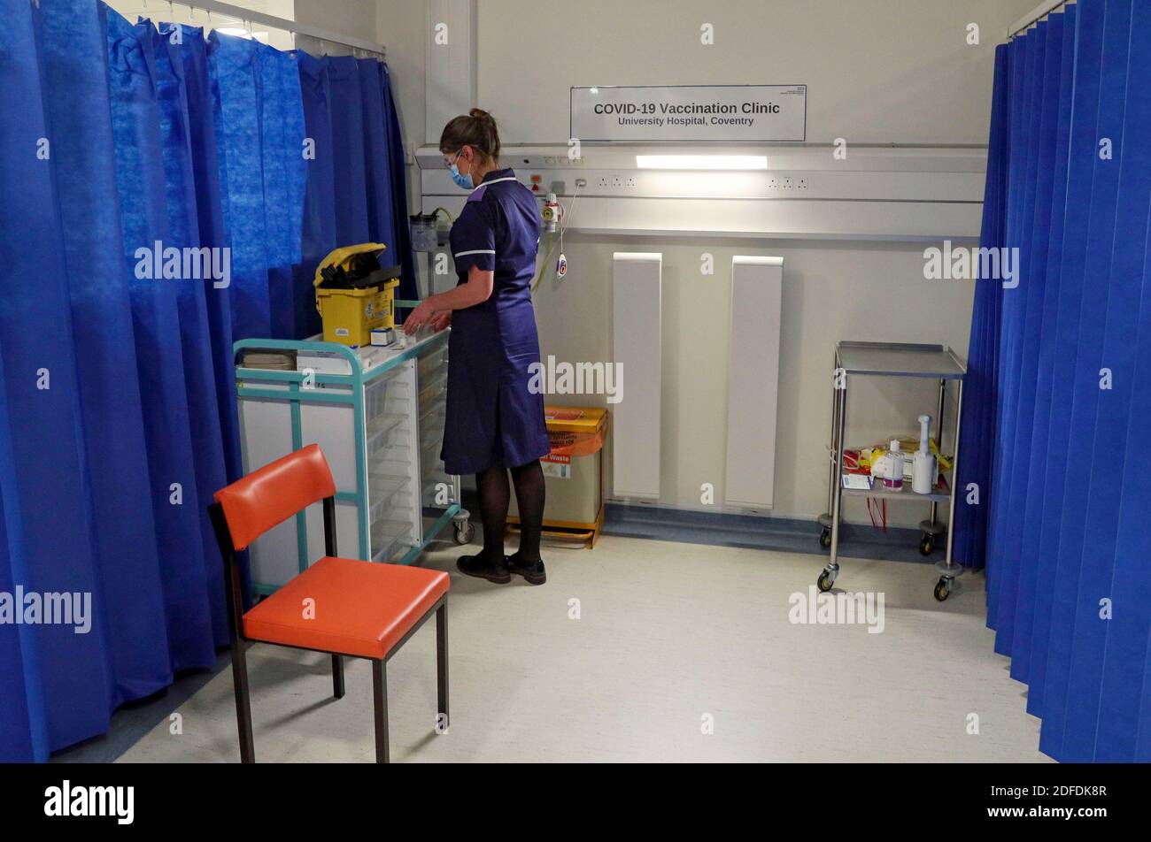 A nurse prepares a cubicle in the Covid-19 Vaccination Clinic at the ...