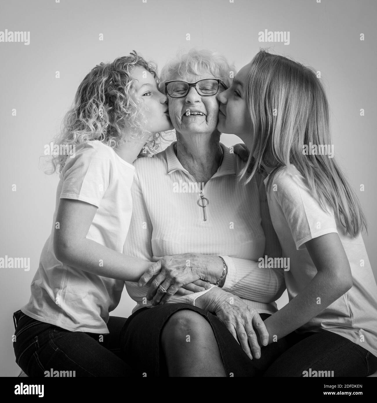 GRANDMOTHER AND HER TWO GRANDDAUGHTERS, FAMILY PORTRAIT Stock Photo - Alamy