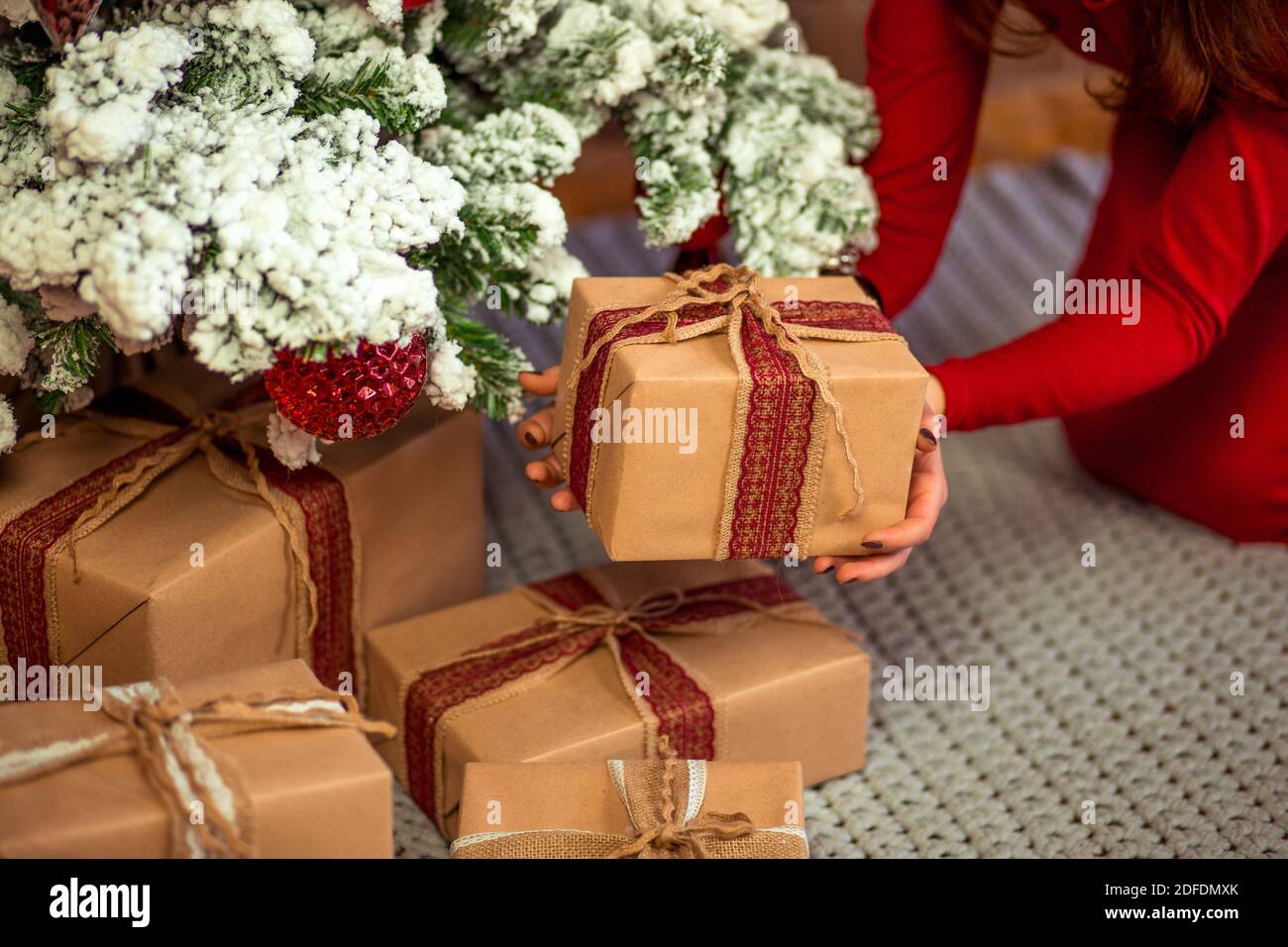 Woman under christmas tree home hi-res stock photography and images - Alamy