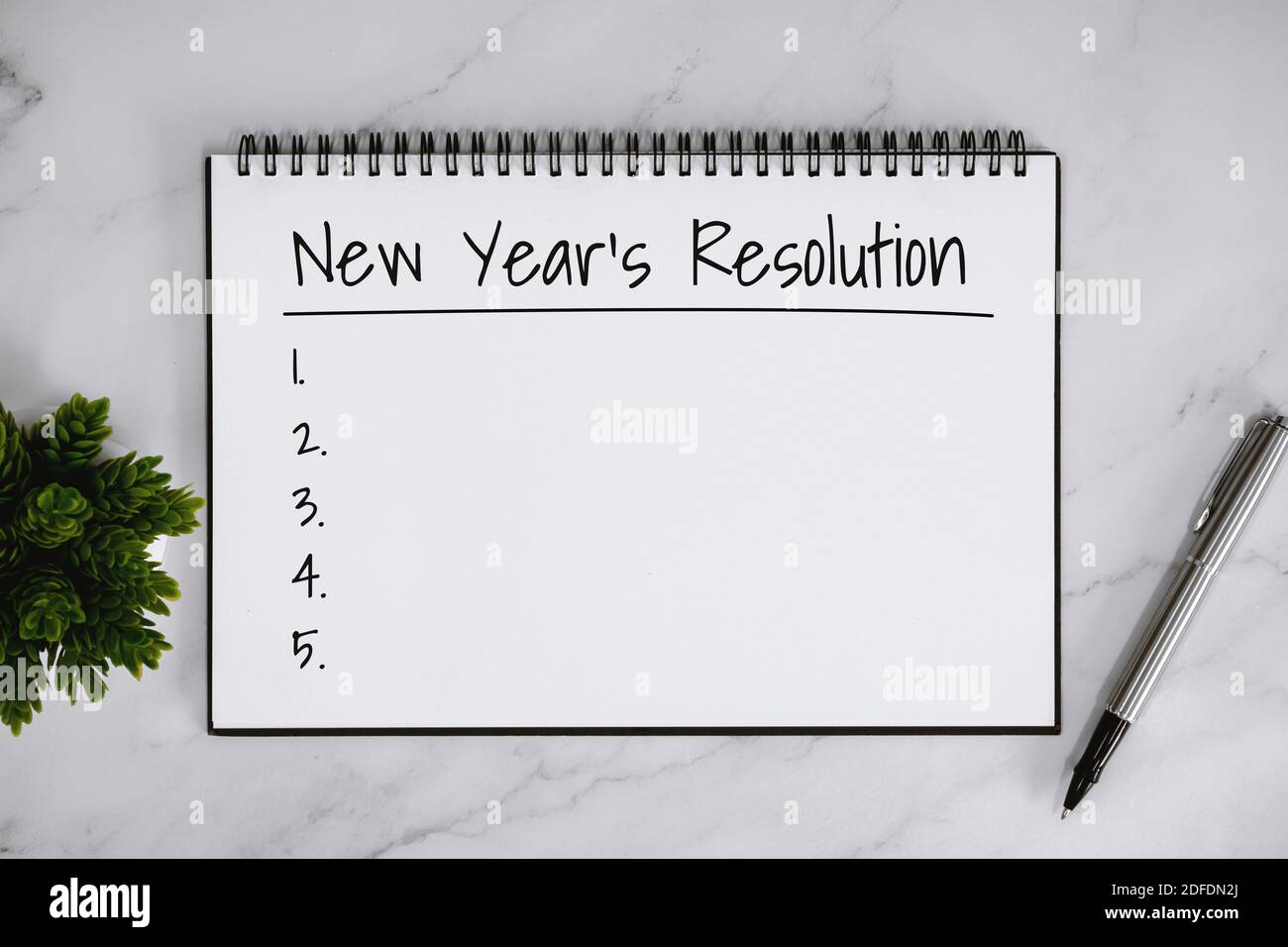 New Year's Resolution List on Notebook Over Work Desk Stock Photo - Alamy