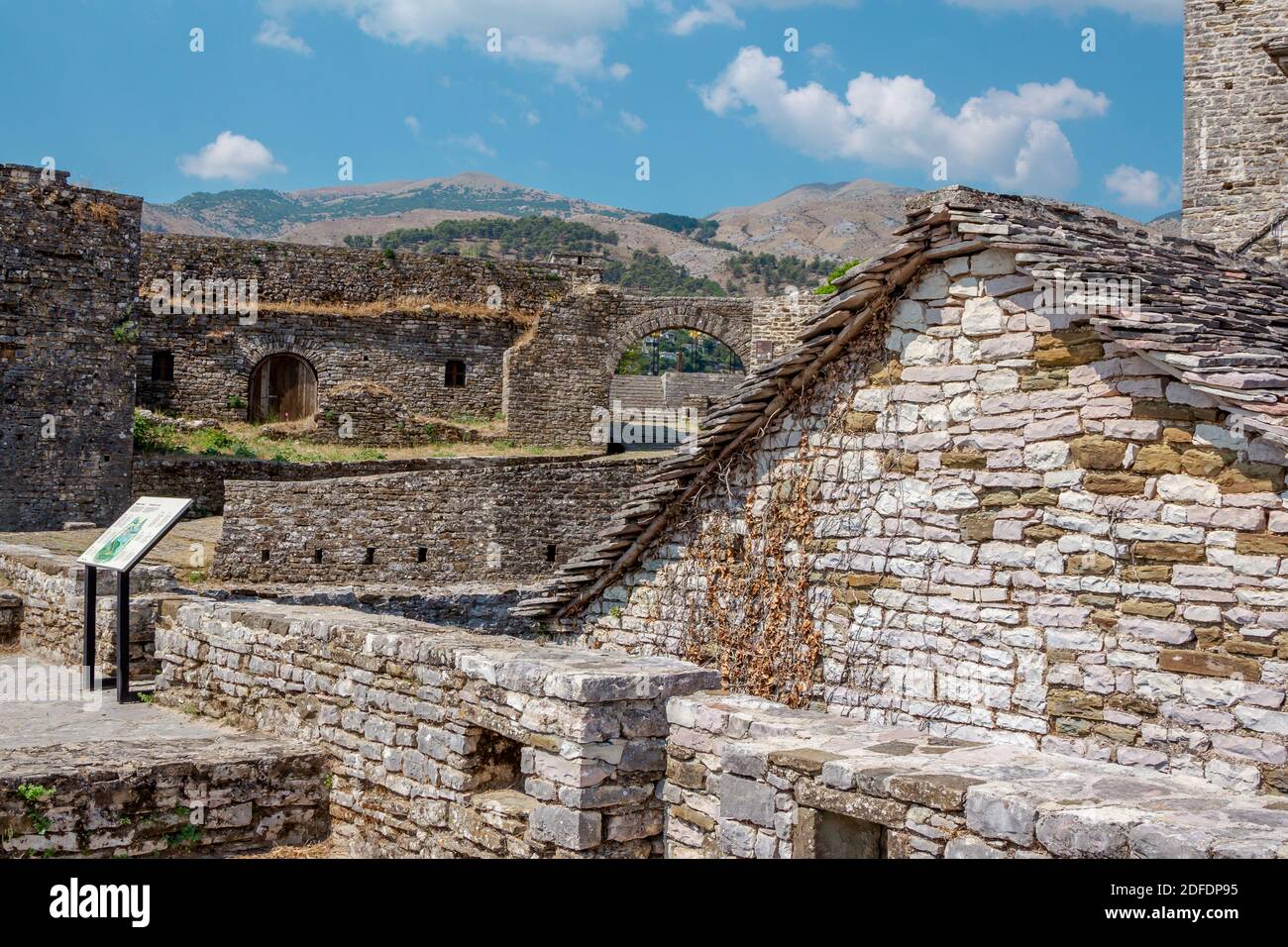 Gjirokaster town/ Albania –August 2, 2020: View of stone walls of ...