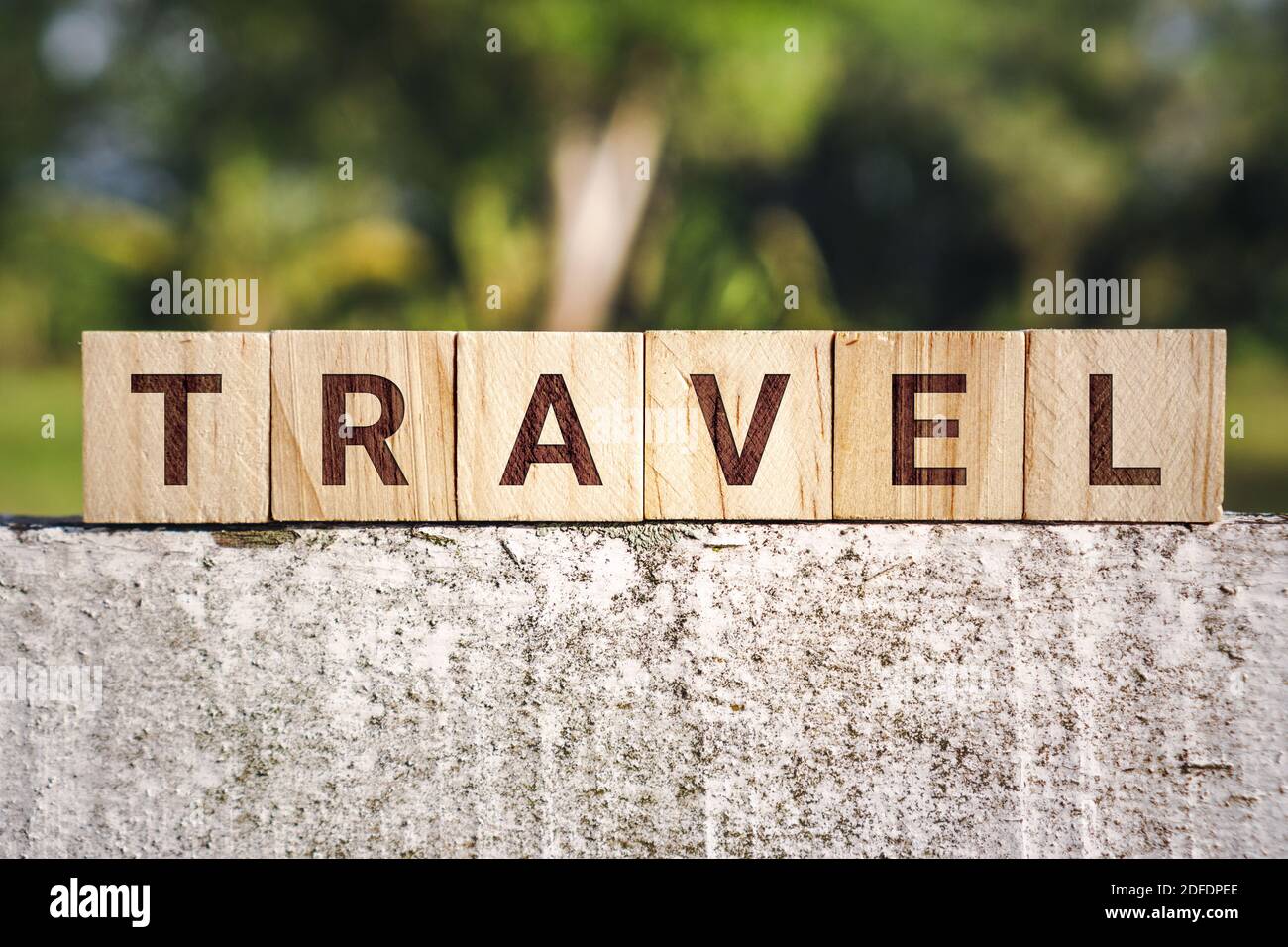 Wooden Block With The Word Travel Stock Photo - Alamy