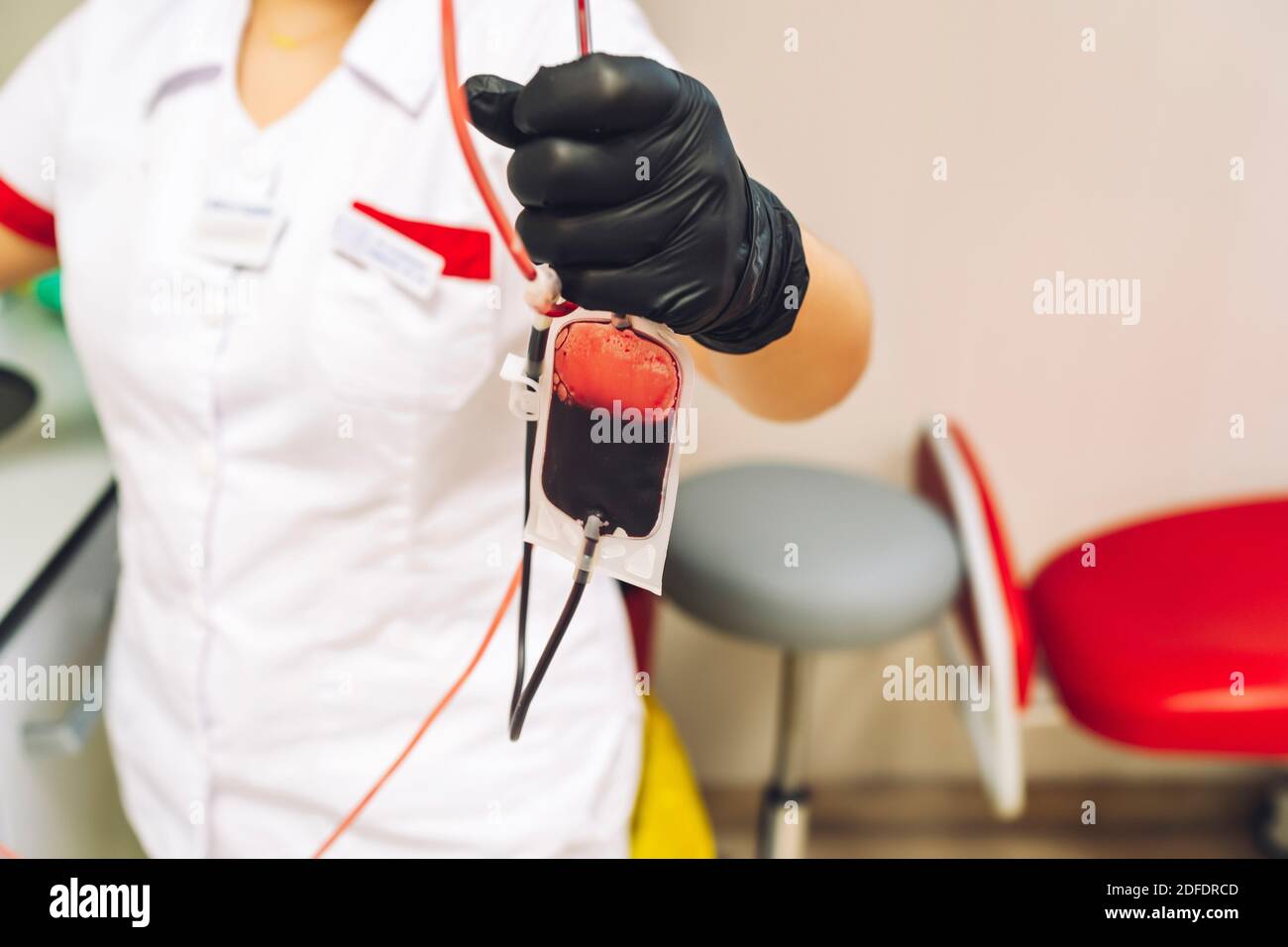 female doctor using blood donation tubes Stock Photo - Alamy