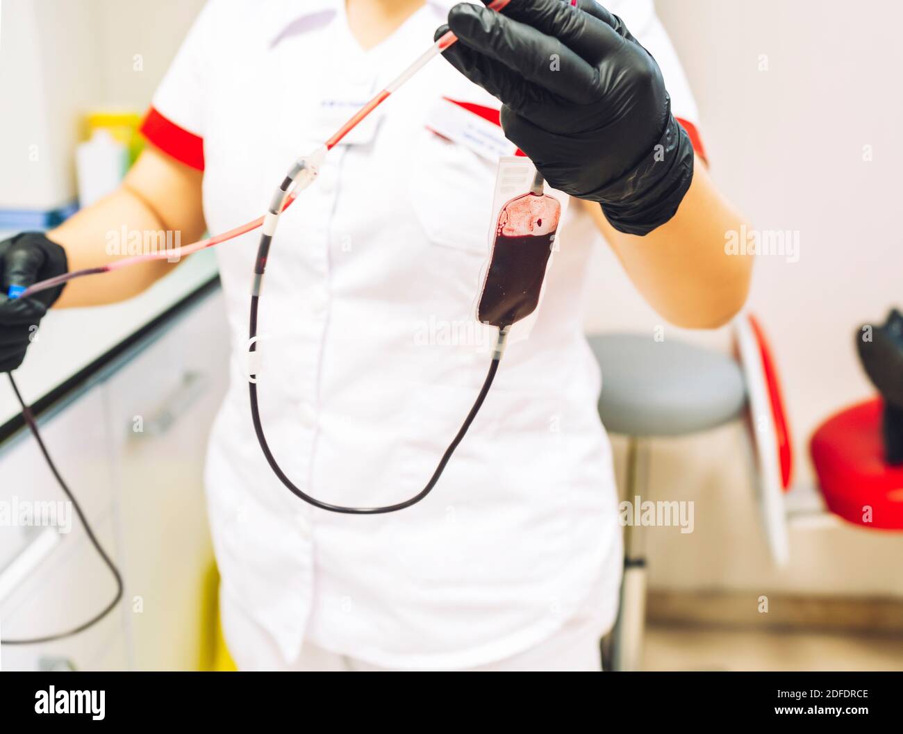 female doctor handling blood donation utensils Stock Photo - Alamy