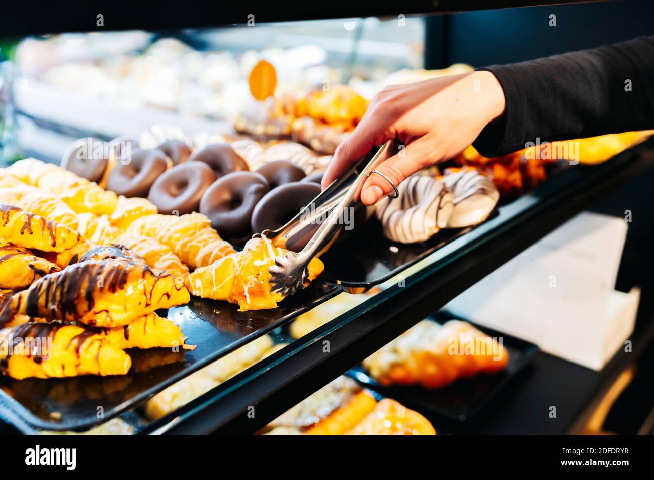 female baker serving fresh cakes Stock Photo - Alamy