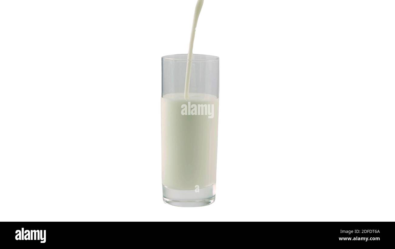 Pour milk kefir into a glass isolated on a white background,close-up ...