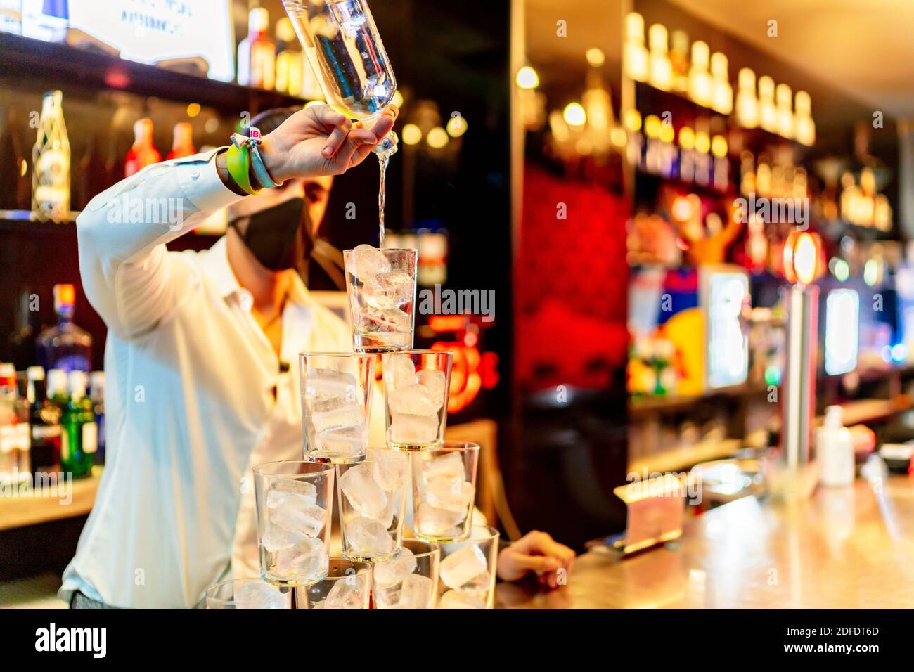 waiter serving drinks in his business Stock Photo - Alamy