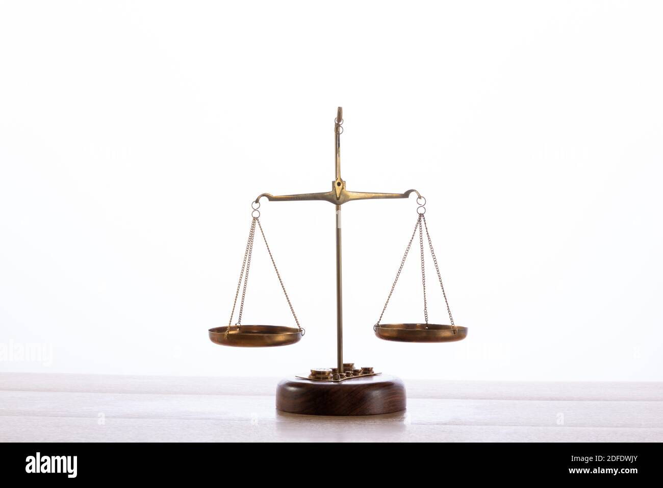 Golden scales isolated on a white background Stock Photo - Alamy