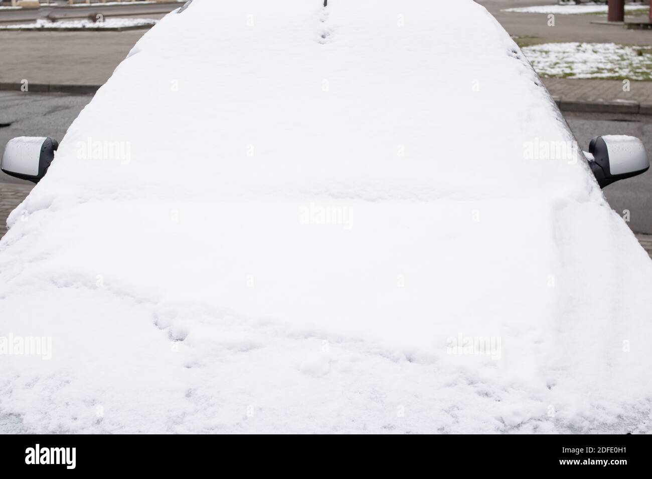 A lot of snow on the hood of the car Stock Photo - Alamy