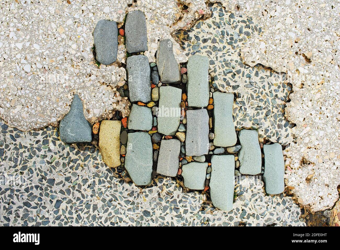 Stones,pebbles and broken concrete in seawall Stock Photo - Alamy