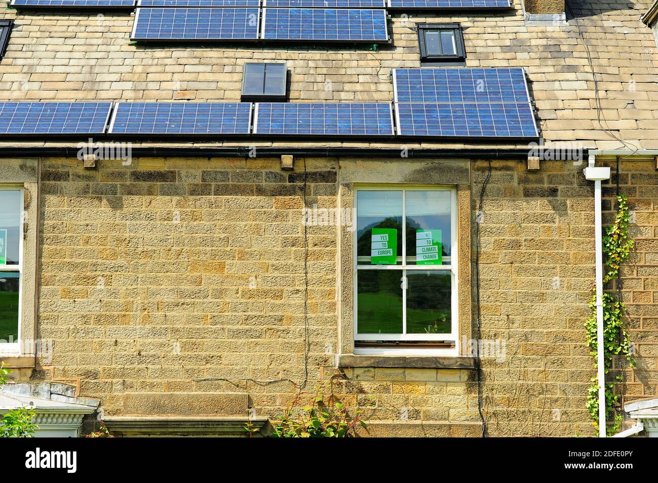Solar panels on the roof of a stone built house Stock Photo - Alamy