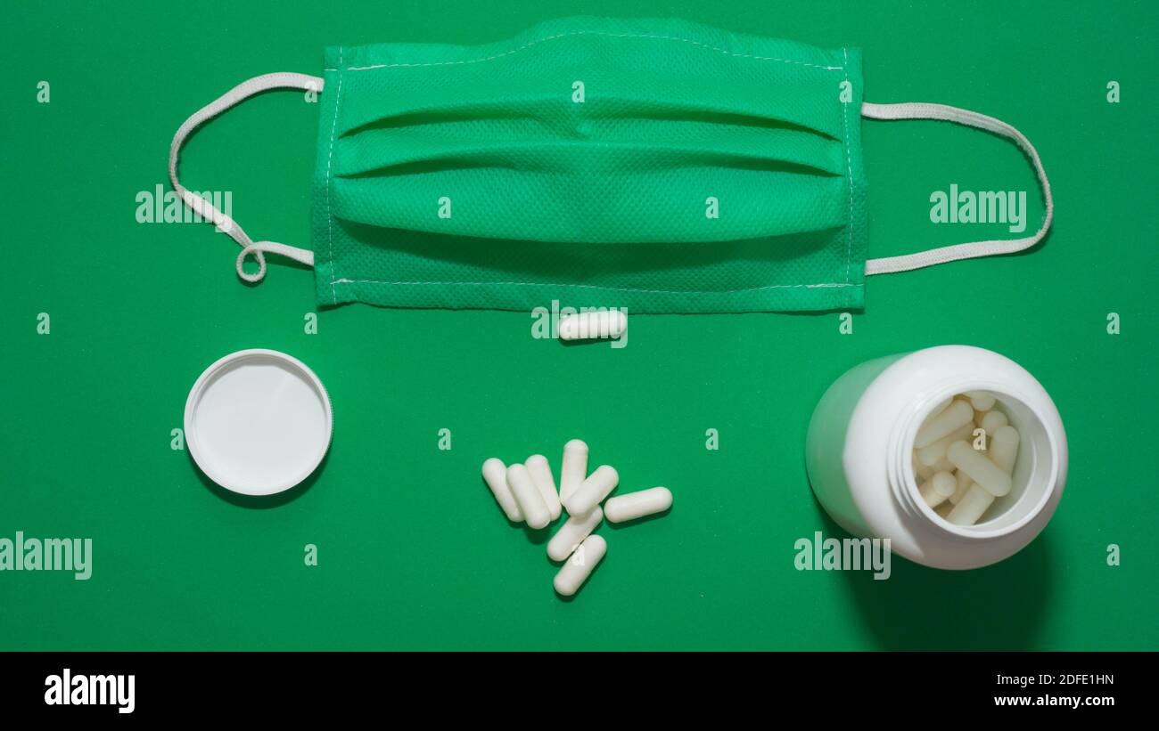 Top view of medical facial mask,medical pills,medical capsules,vitamins ...