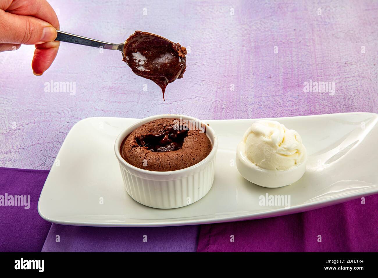 Delicious chocolate souffle with ice cream. Fluid chocolate souffle on ...