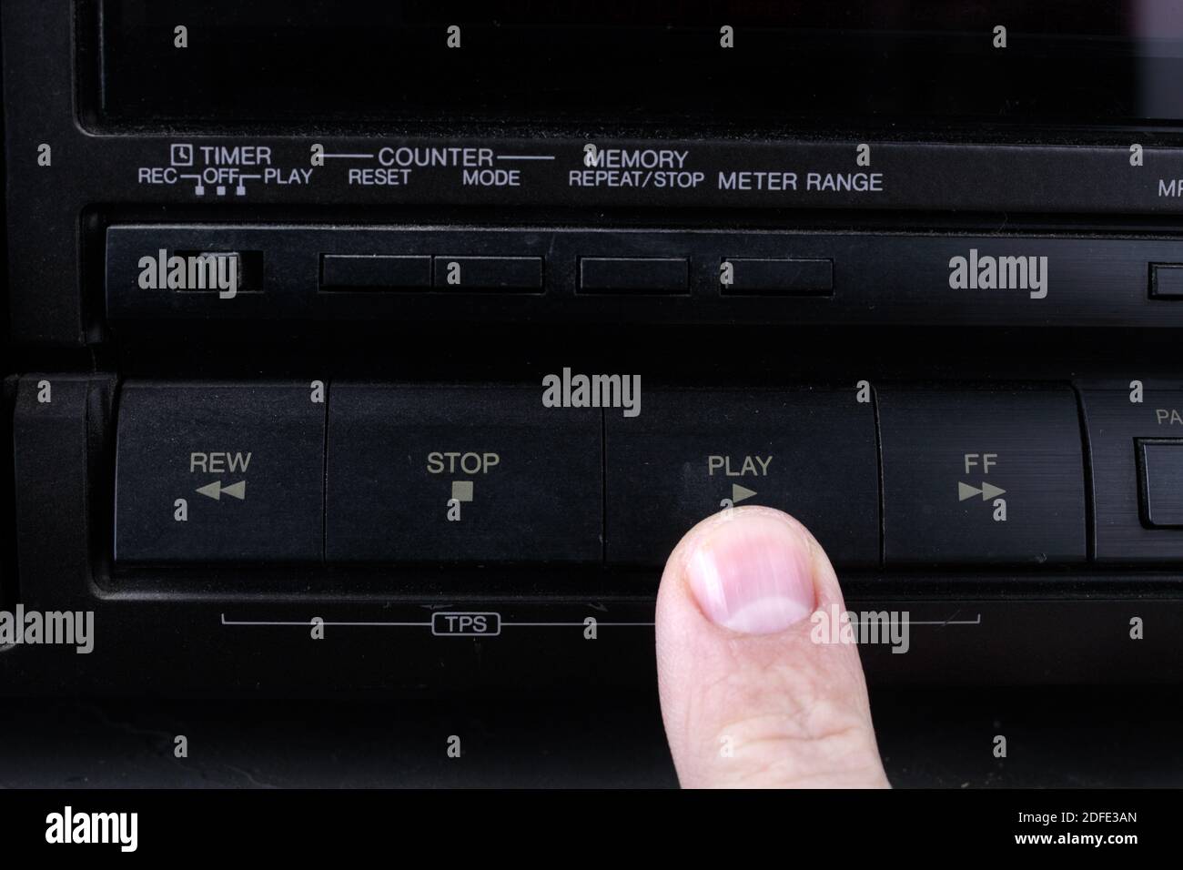 Press play button on retro audio cassette tape recorder Stock Photo - Alamy