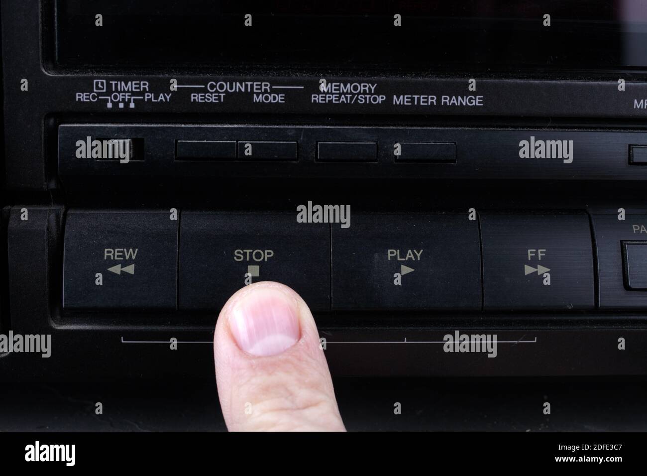 Press stop button on retro audio cassette tape recorder Stock Photo - Alamy