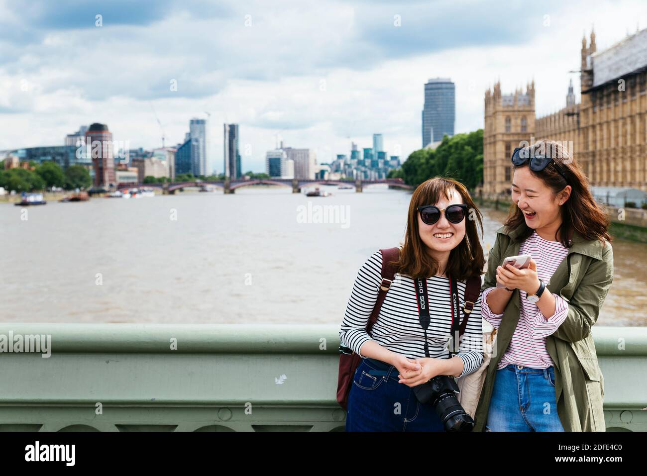 Two Asian young women on the Westminster Bridge. London, England ...