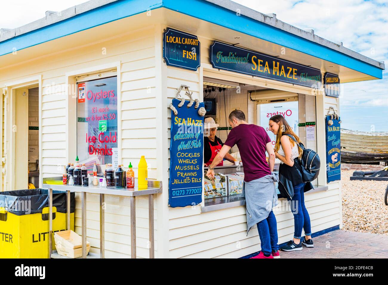 Stall selling local fried fish on the promenade. Brighton, East Sussex ...