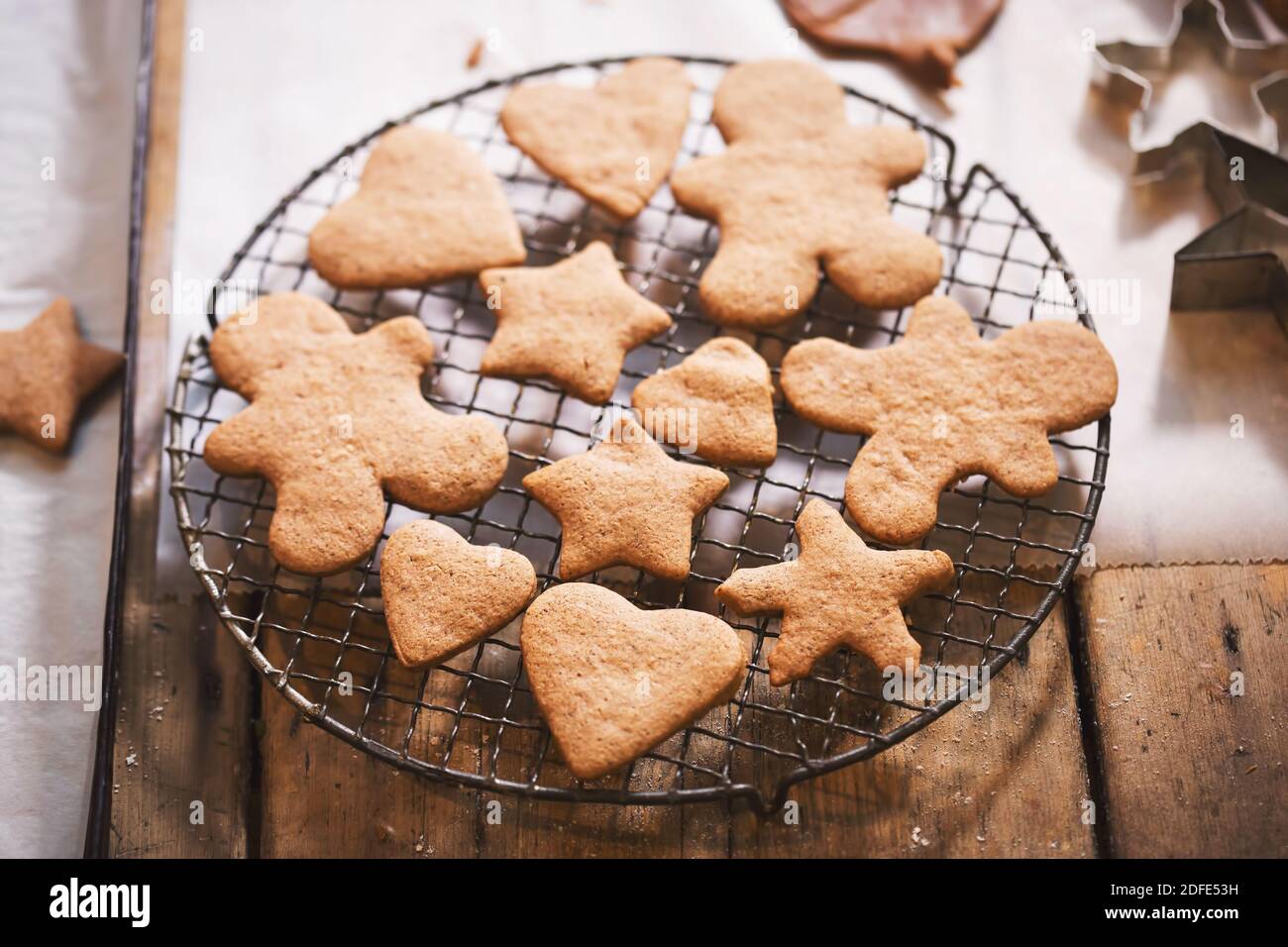 Different shaped gingerbread cookies on cooling rack Stock Photo - Alamy