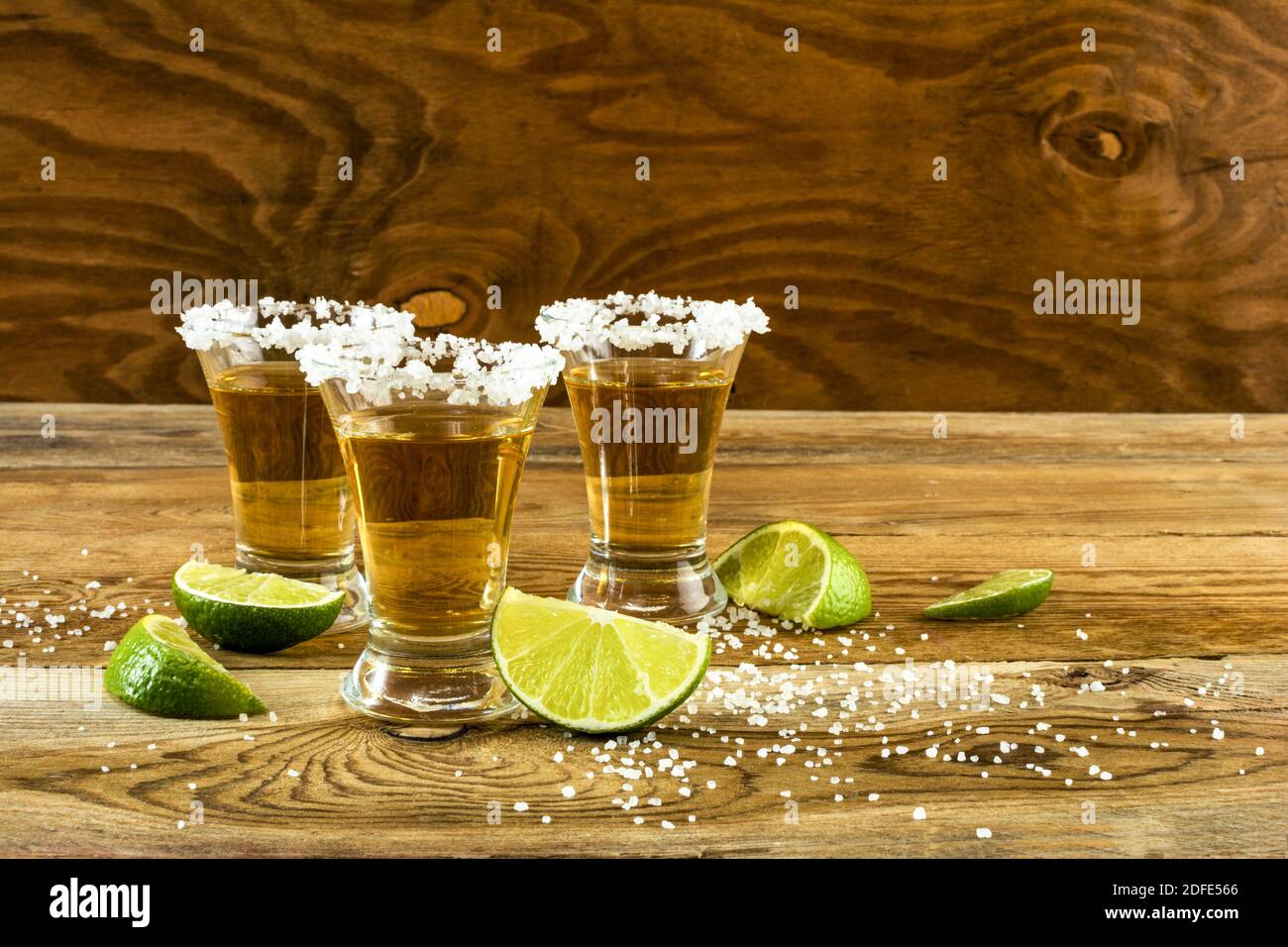 Three tequila shots copy space. Tequila shot. Gold Mexican tequila ...