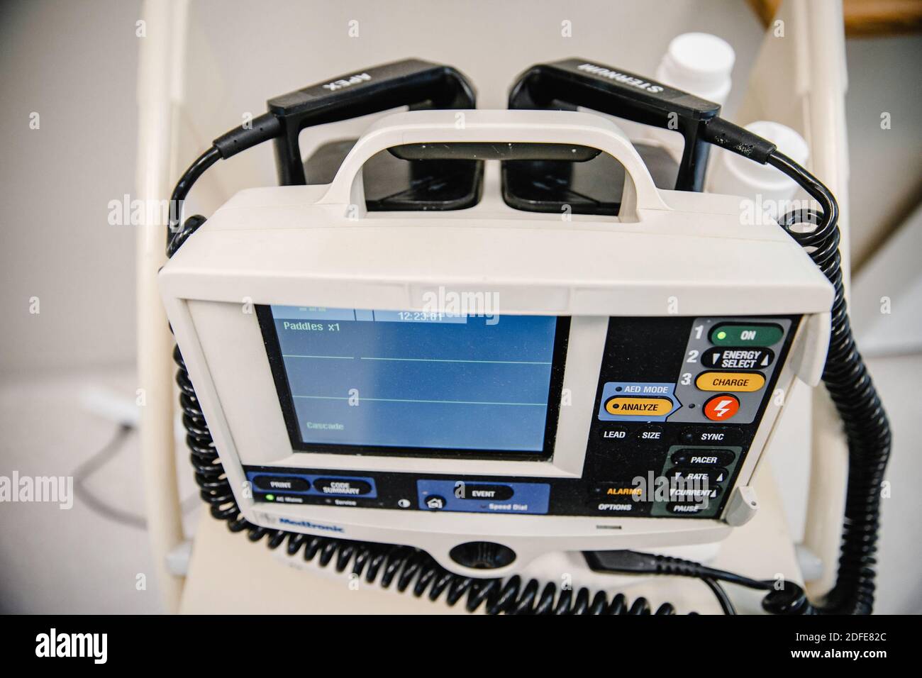 An automated external defibrillator, a device that restores a normal ...