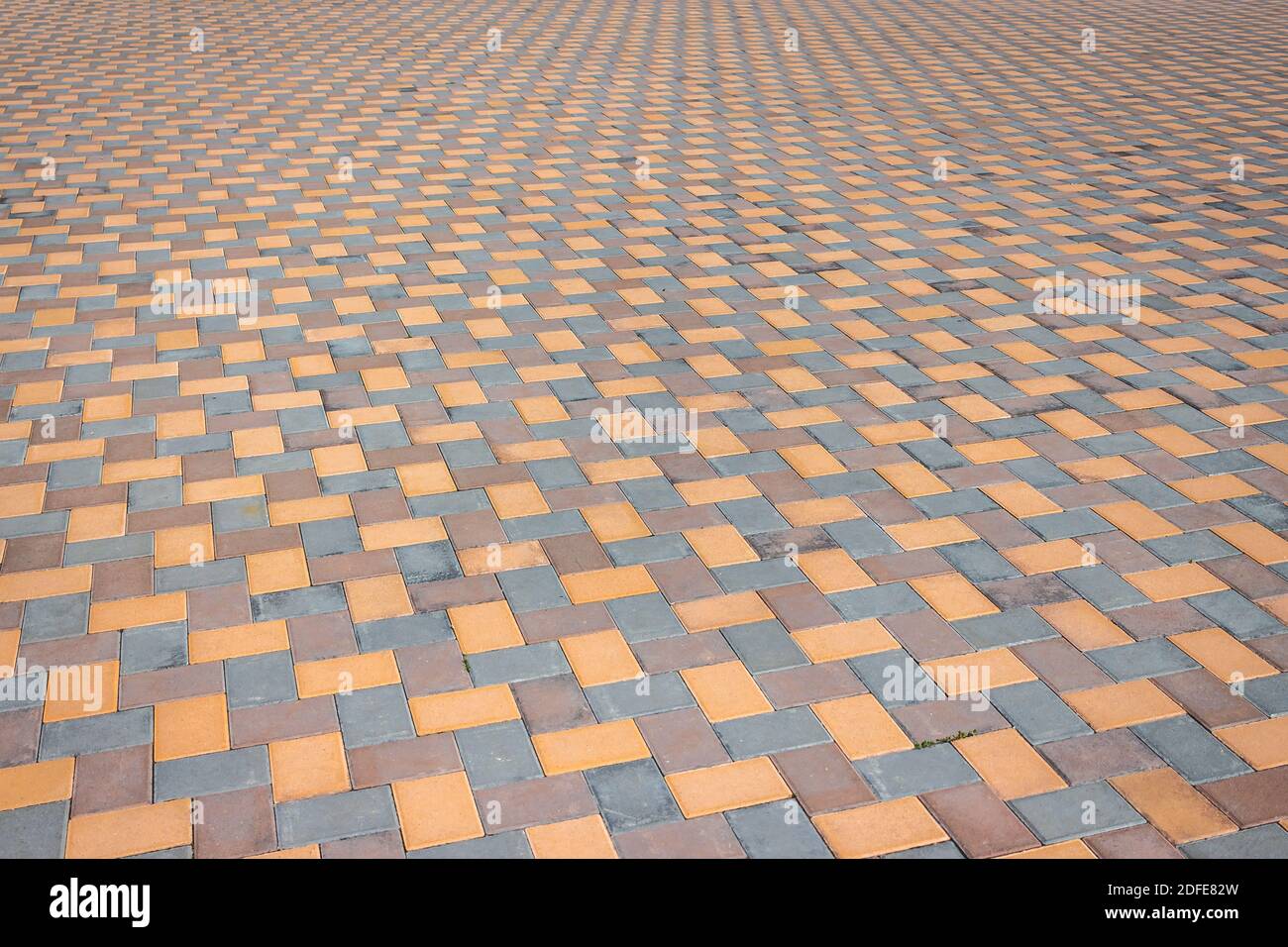 A colorful tiled pavement texture in a park Stock Photo - Alamy
