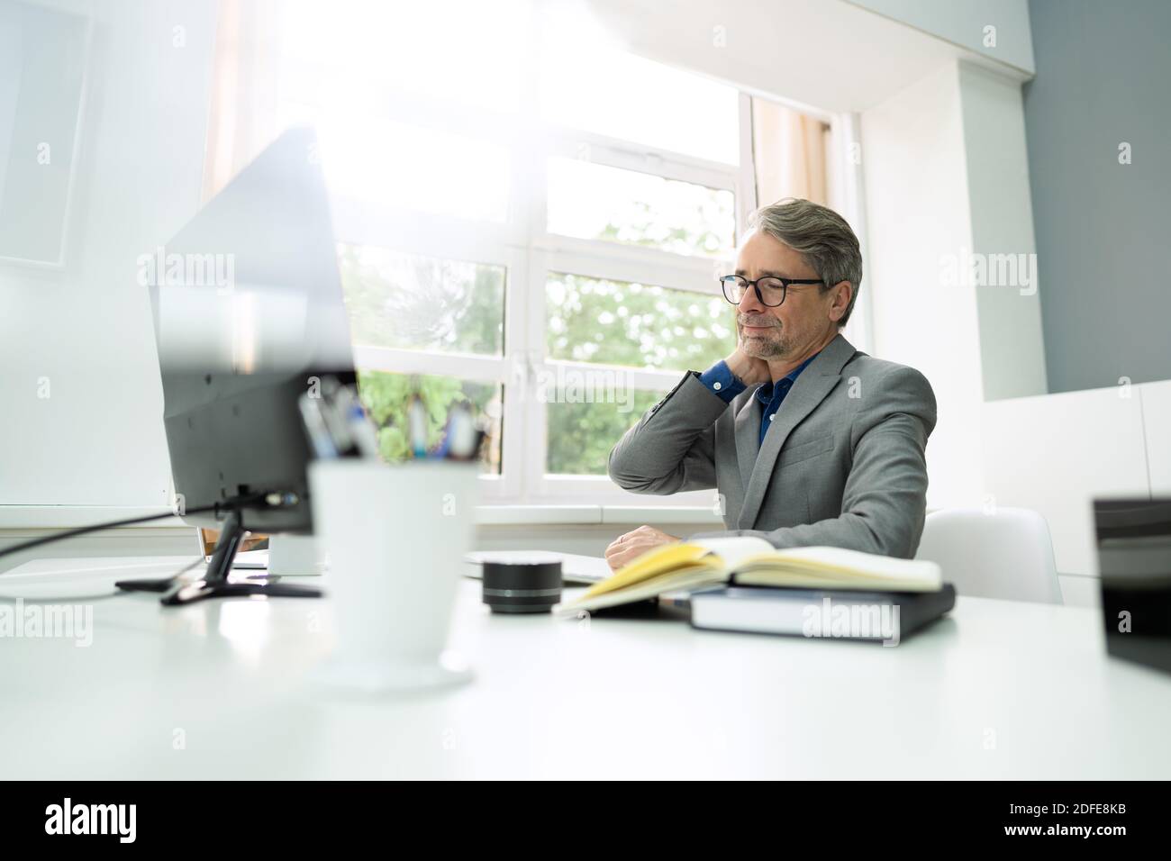 Office Computer Work Neck Pain. Bad Ergonomics Stock Photo - Alamy