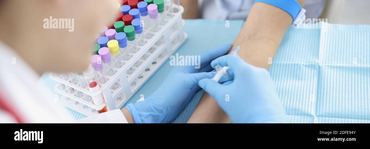 Doctor injects patient into a vein closeup Stock Photo - Alamy